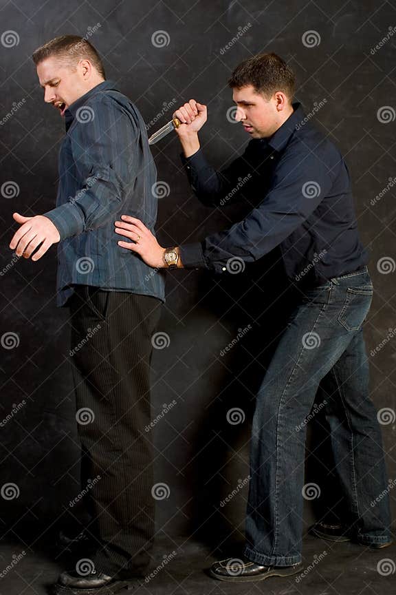 Stab in the back stock photo. Image of bitter, back, annoyed - 1701264