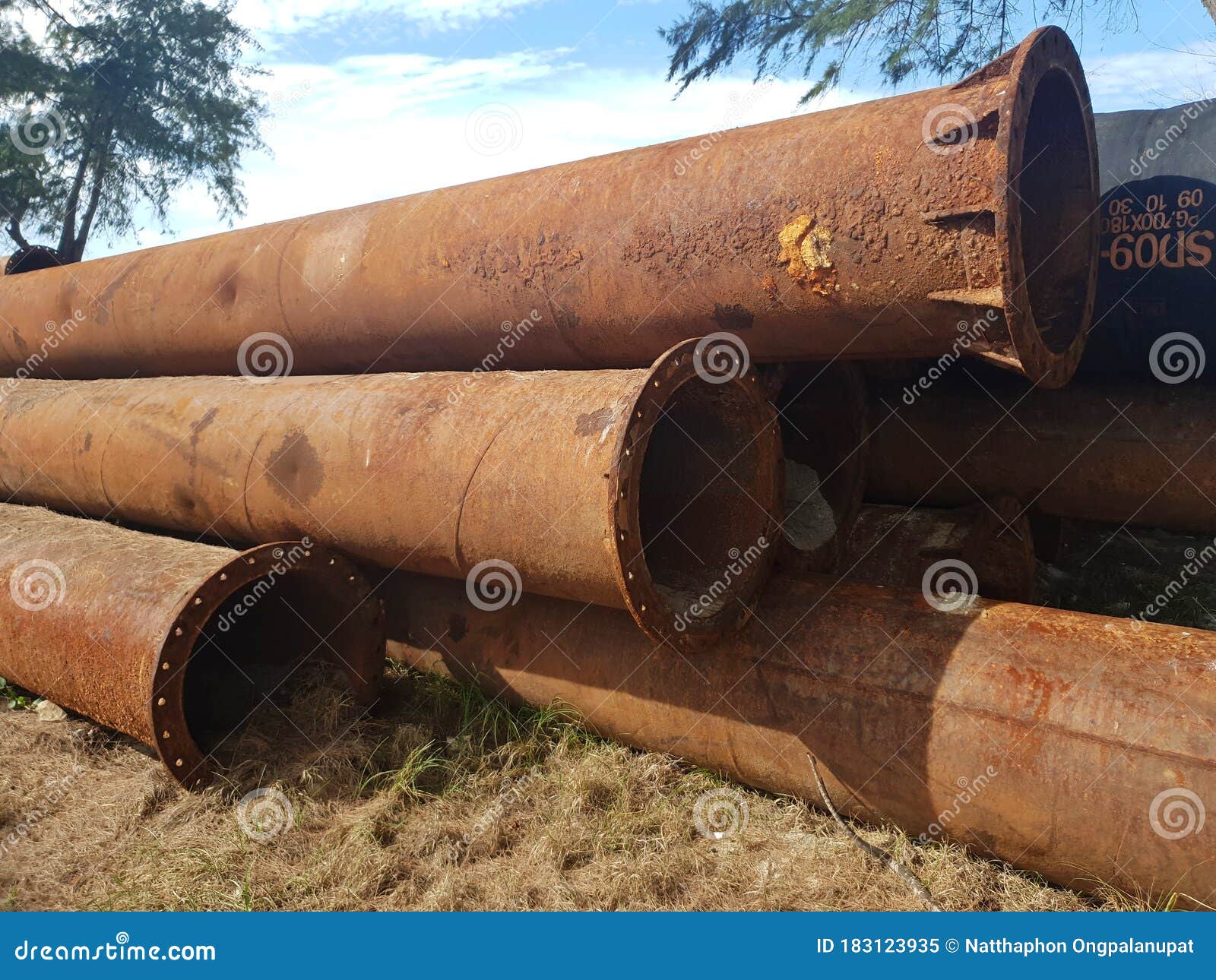 Stack of Abandoned Rustic Pipeline Laid on the Sand Beach Stock Image ...