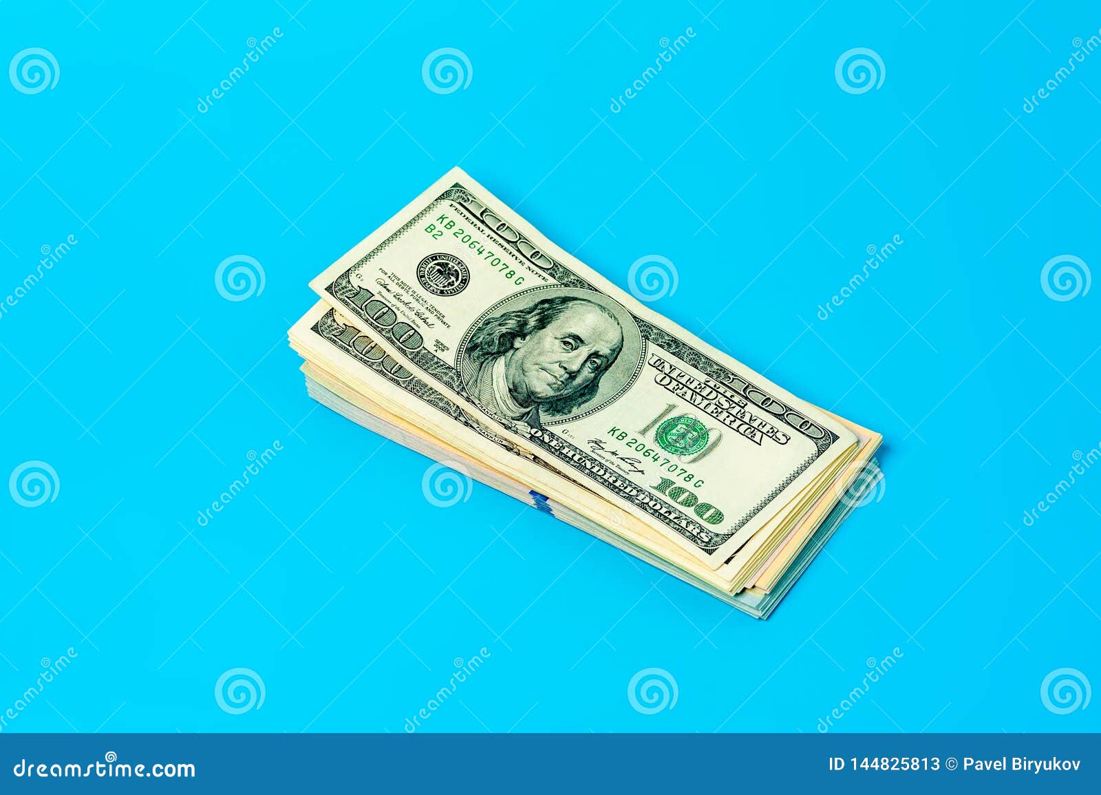 Stack of American Dollar Bills on Blue Background. Stock Image - Image ...