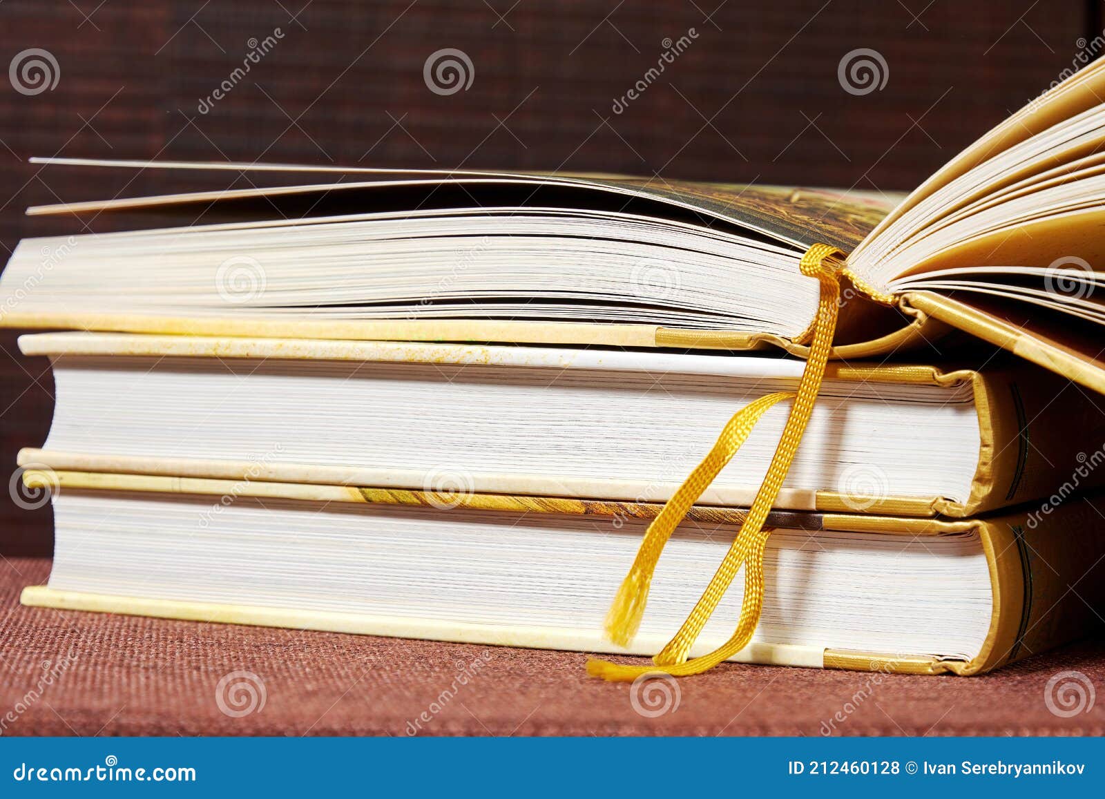 Stack of Ancient Books with One Opened Book Above the Heap on the ...