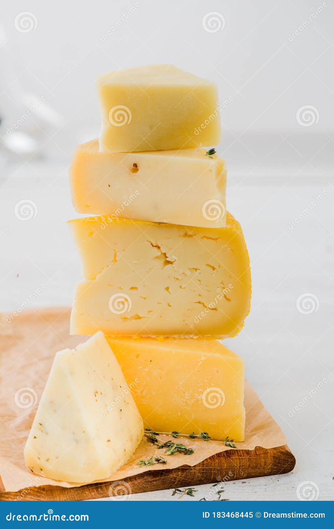 Stack of Assorted Cheeses Isolated on White BackgroundStack of Assorted ...