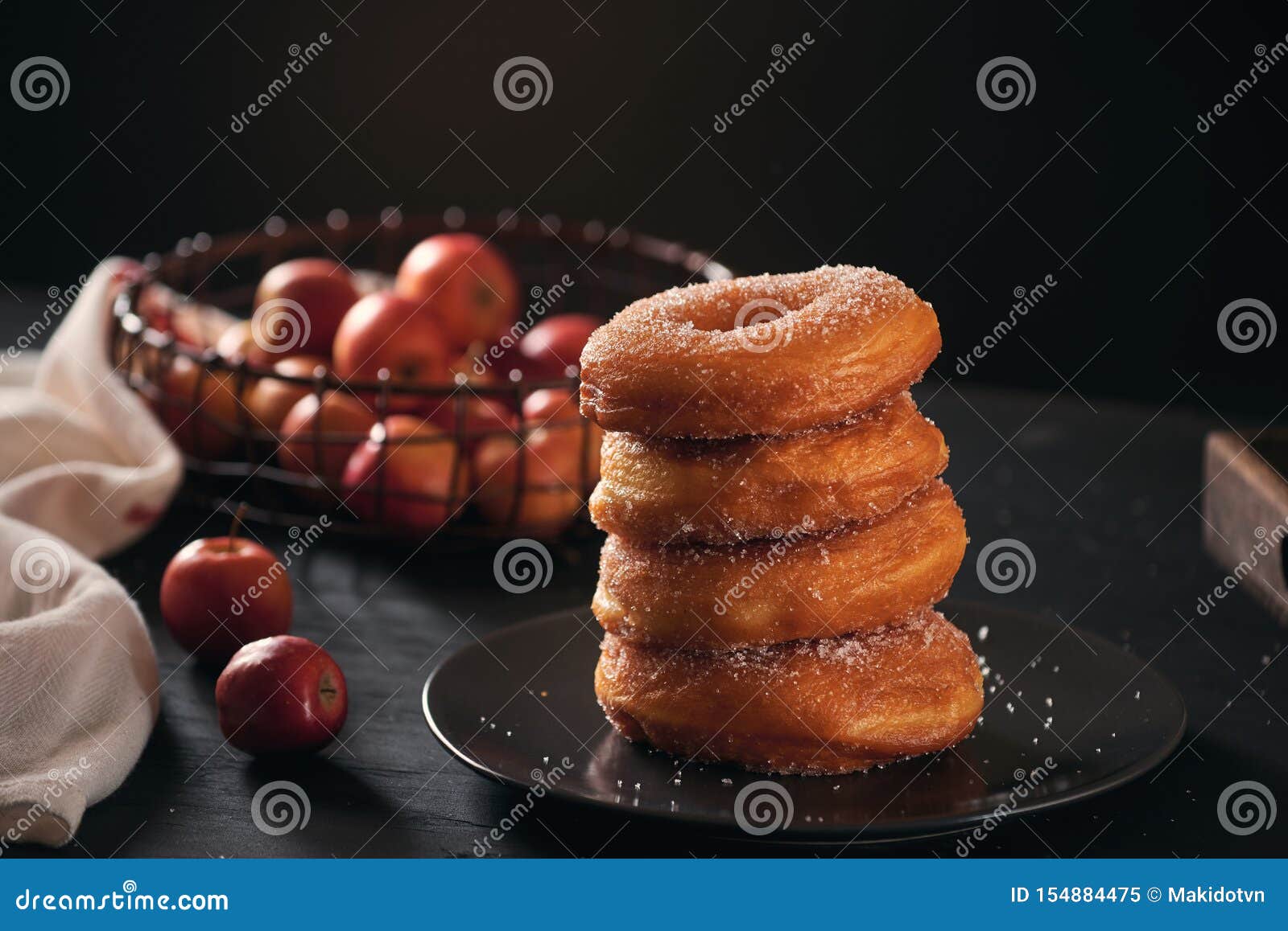 Stack of Assorted Donuts on a Plate with Milk on Black Background Stock ...