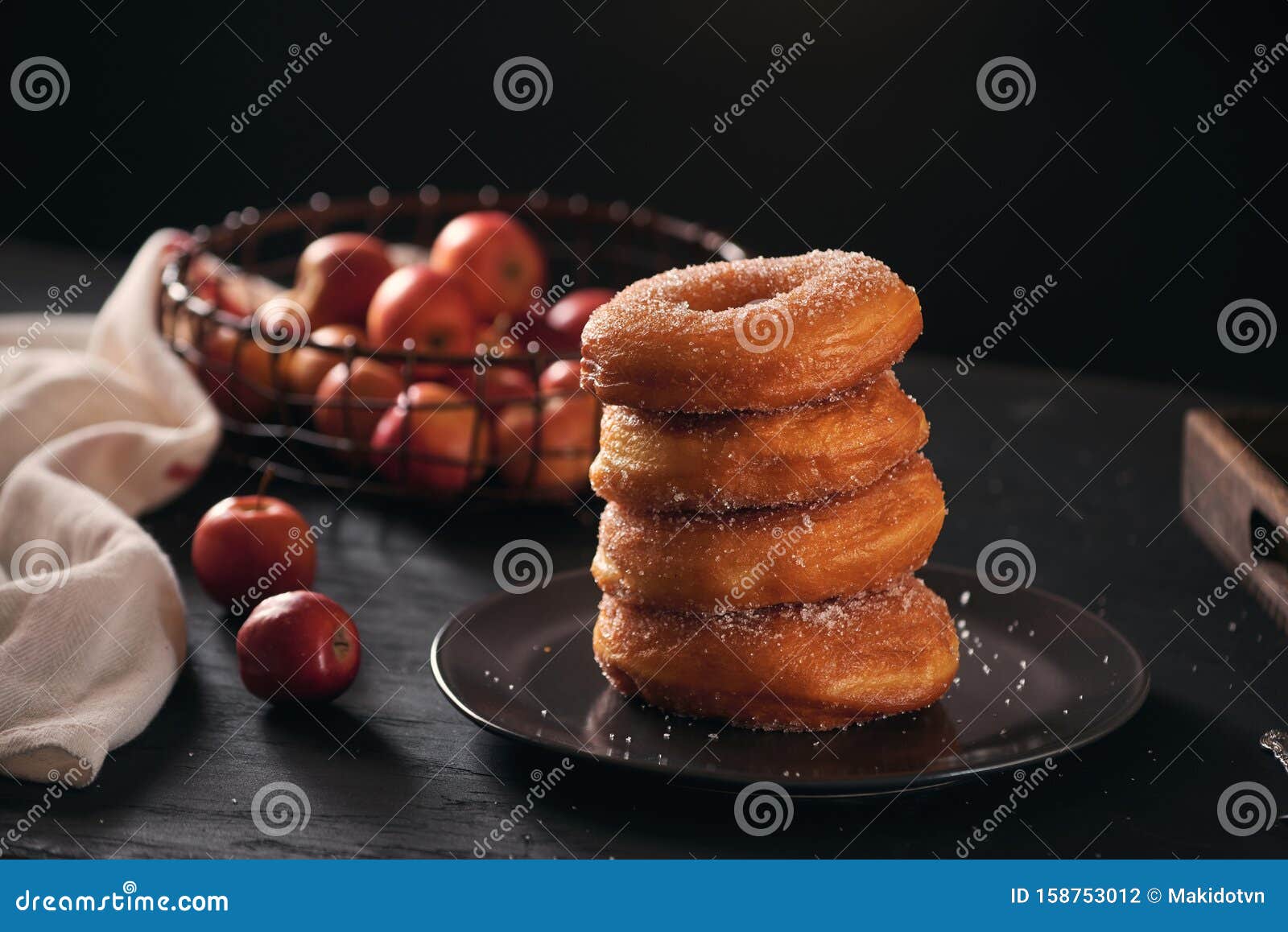 Stack of Assorted Donuts on a Plate with Milk on Black Background Stock ...