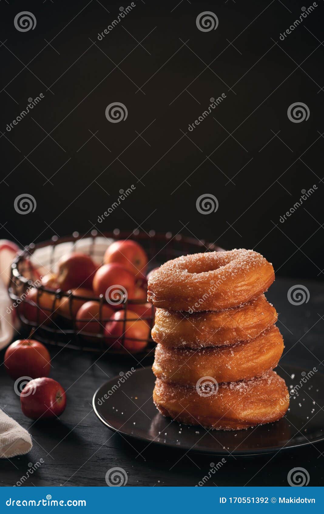 Stack of Assorted Donuts on a Plate with Milk on Black Background Stock ...