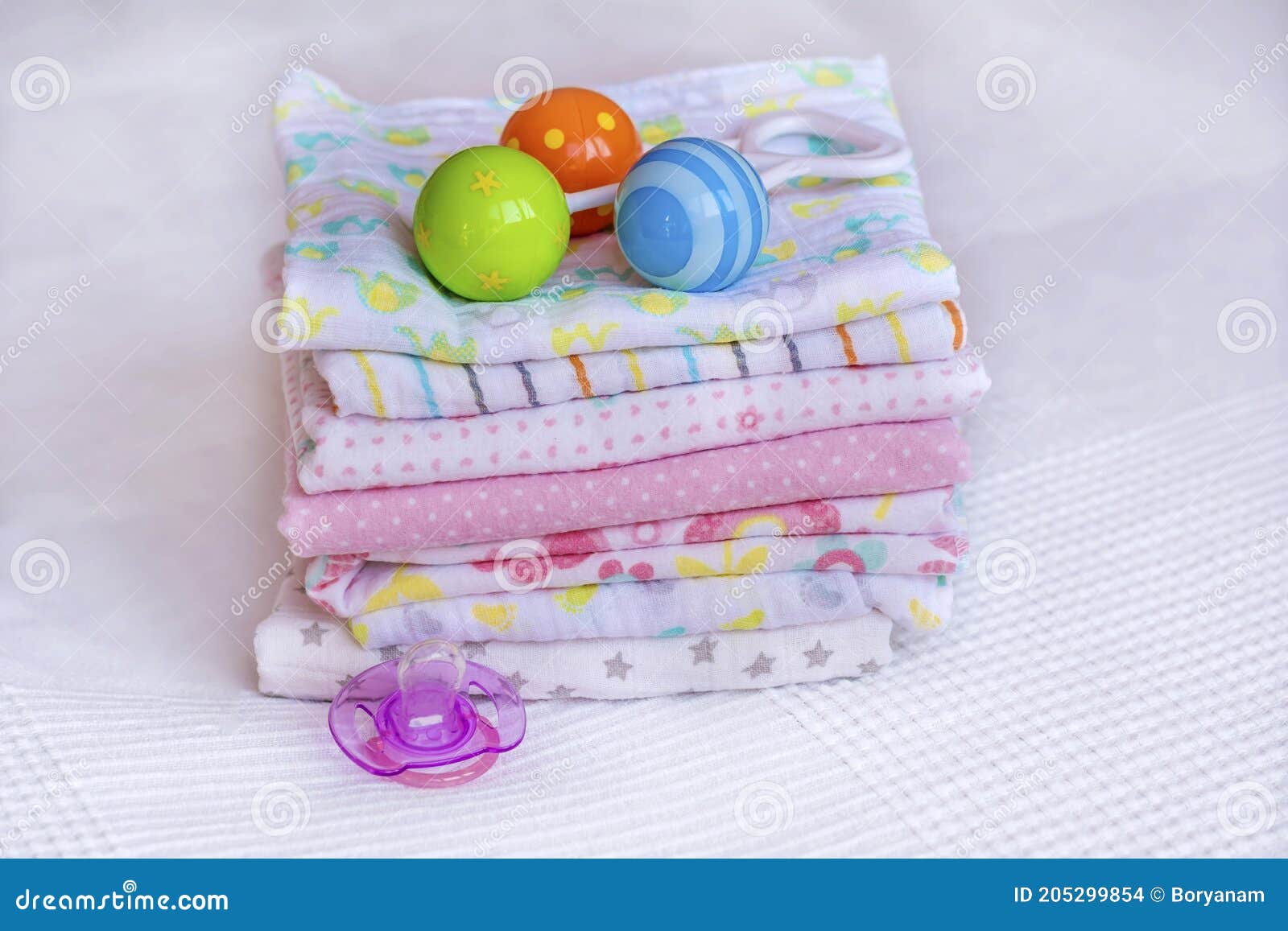 Stack of Baby Diapers and Baby Rattle Stock Photo - Image of baby ...