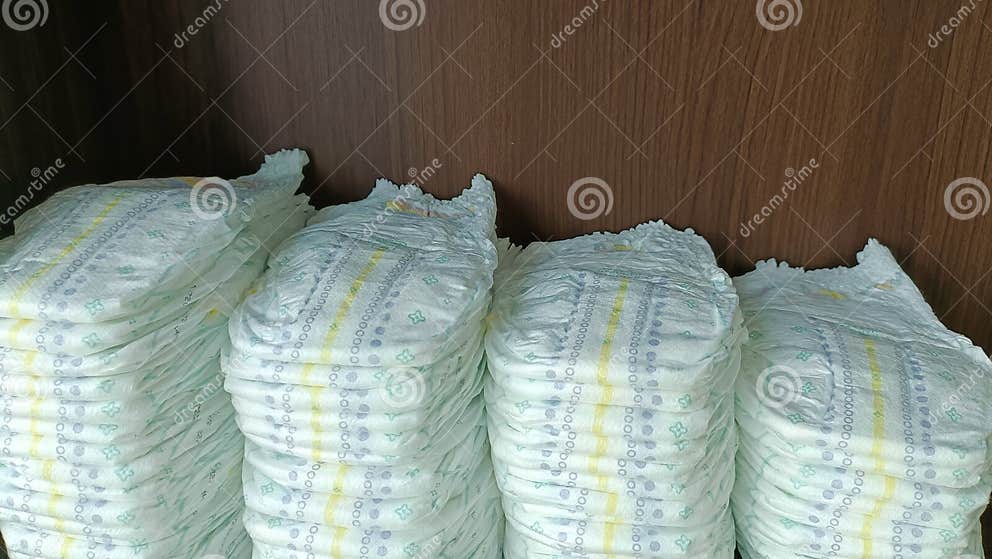 Stack of Baby Diapers on a Shelf. Stock Photo - Image of toddler ...