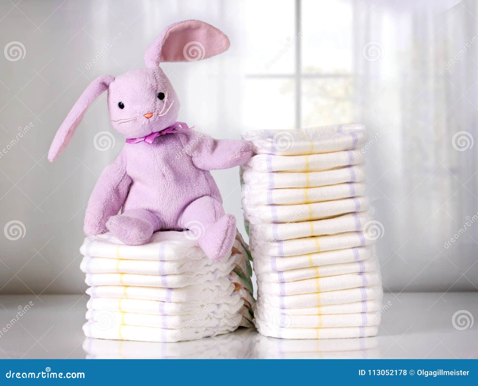 Toy Bunny Sitting On Stack Of Disposable Diapers Or Nappies,Stack Of ...