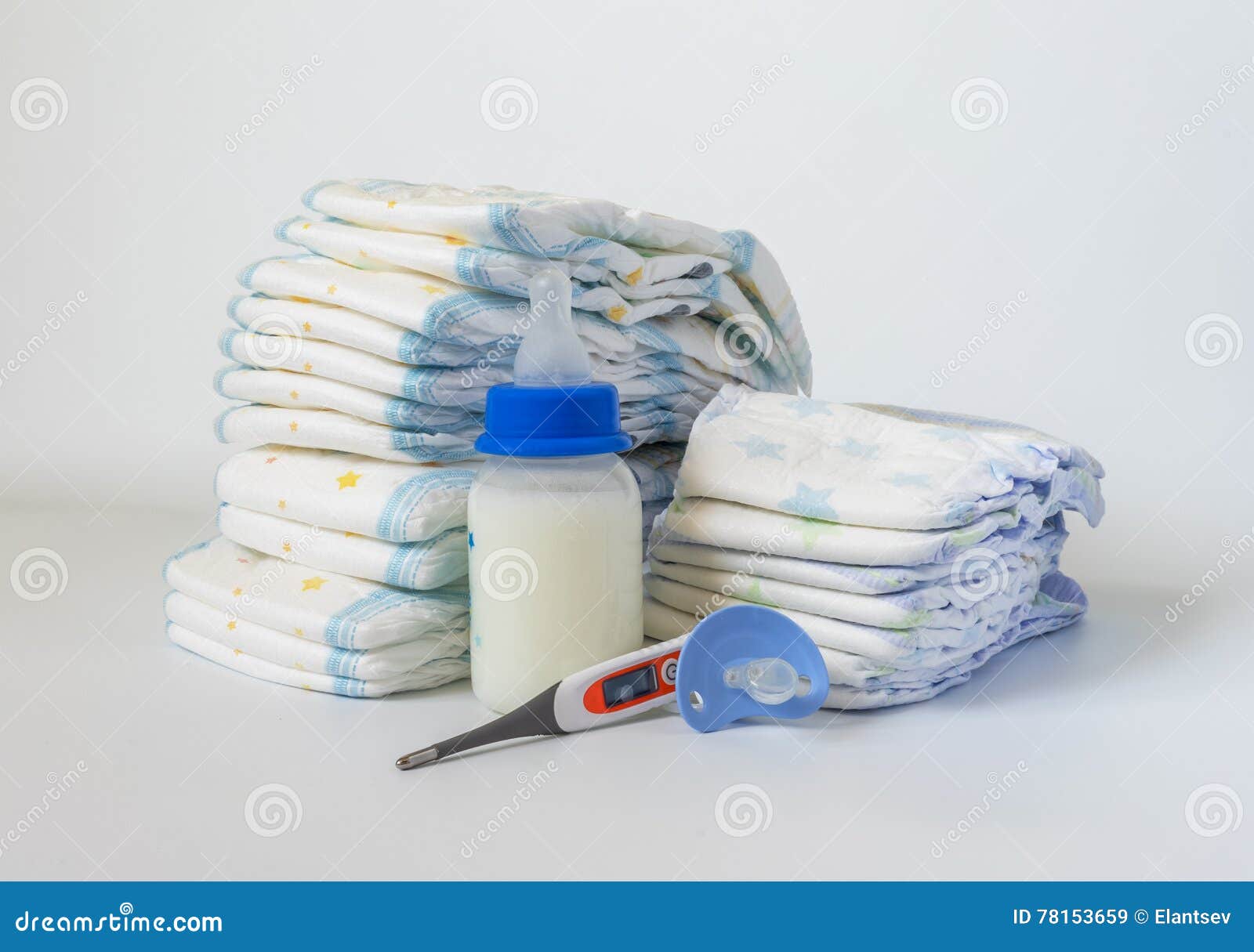 Stack of Baby Disposable Diapers, Pacifier and Electronic Thermometers ...