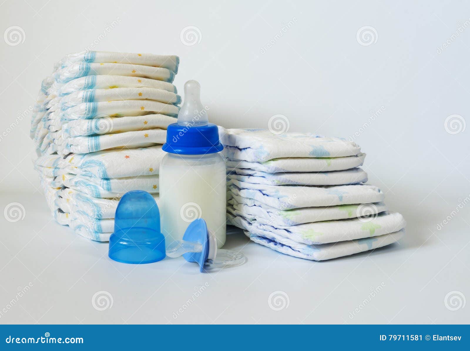 Stack of Baby Disposable Diapers, Pacifier and Electronic Thermometers ...