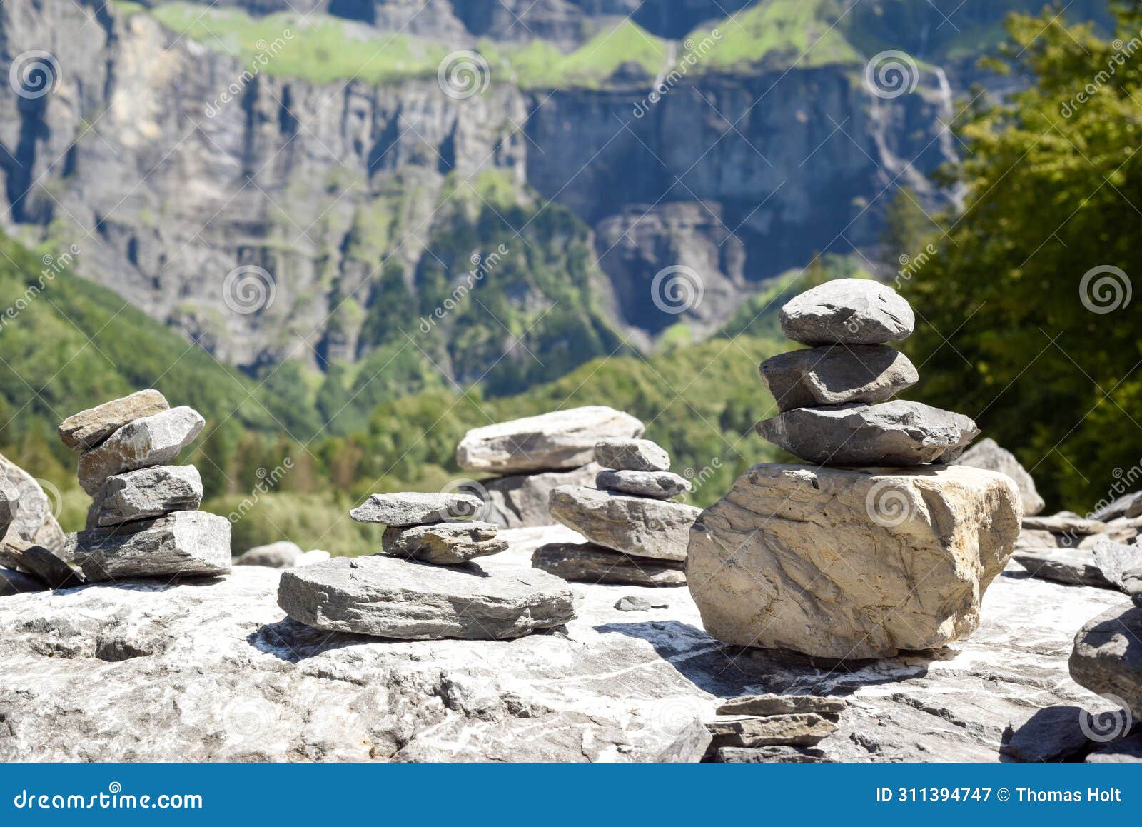 Stack of Balancing Rocks Symbolising Peace and Mindfulness Over a Lush ...
