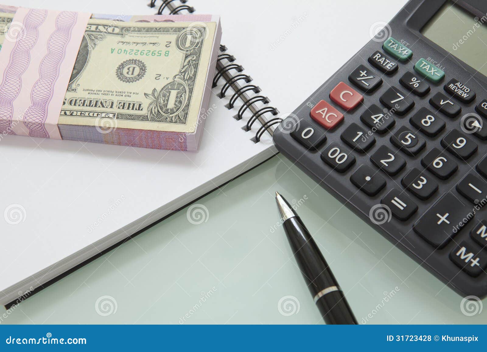Stack of Bank Note and Pen Calculater on Note Book Stock Photo - Image ...