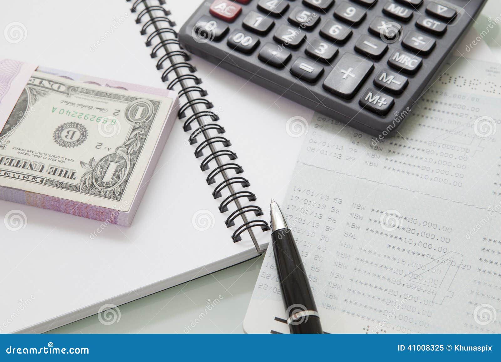 Stack Of Bank Note And Pen Calculater On Note Book Stock Photo ...