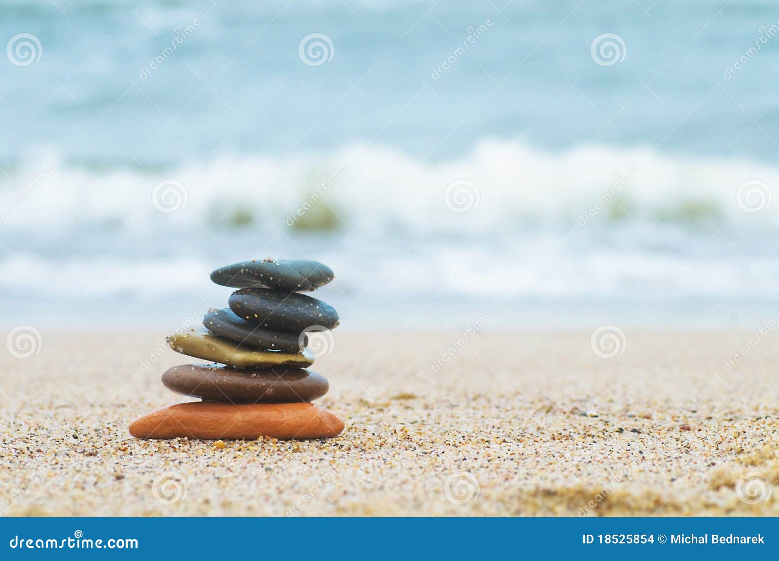 Stack of Beach Stones on Sand Stock Photo - Image of outdoors ...
