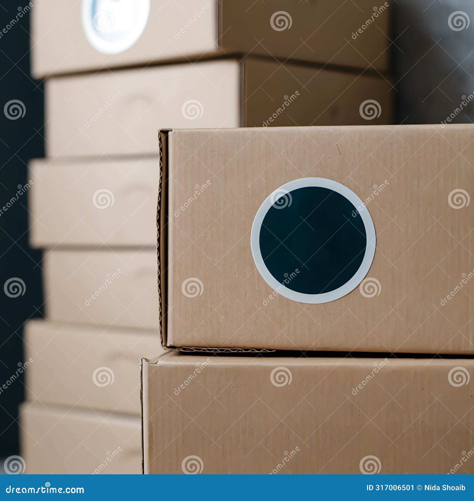 Stack of Beige Boxes with Logo Sticker, Blurred Background Emphasizes ...