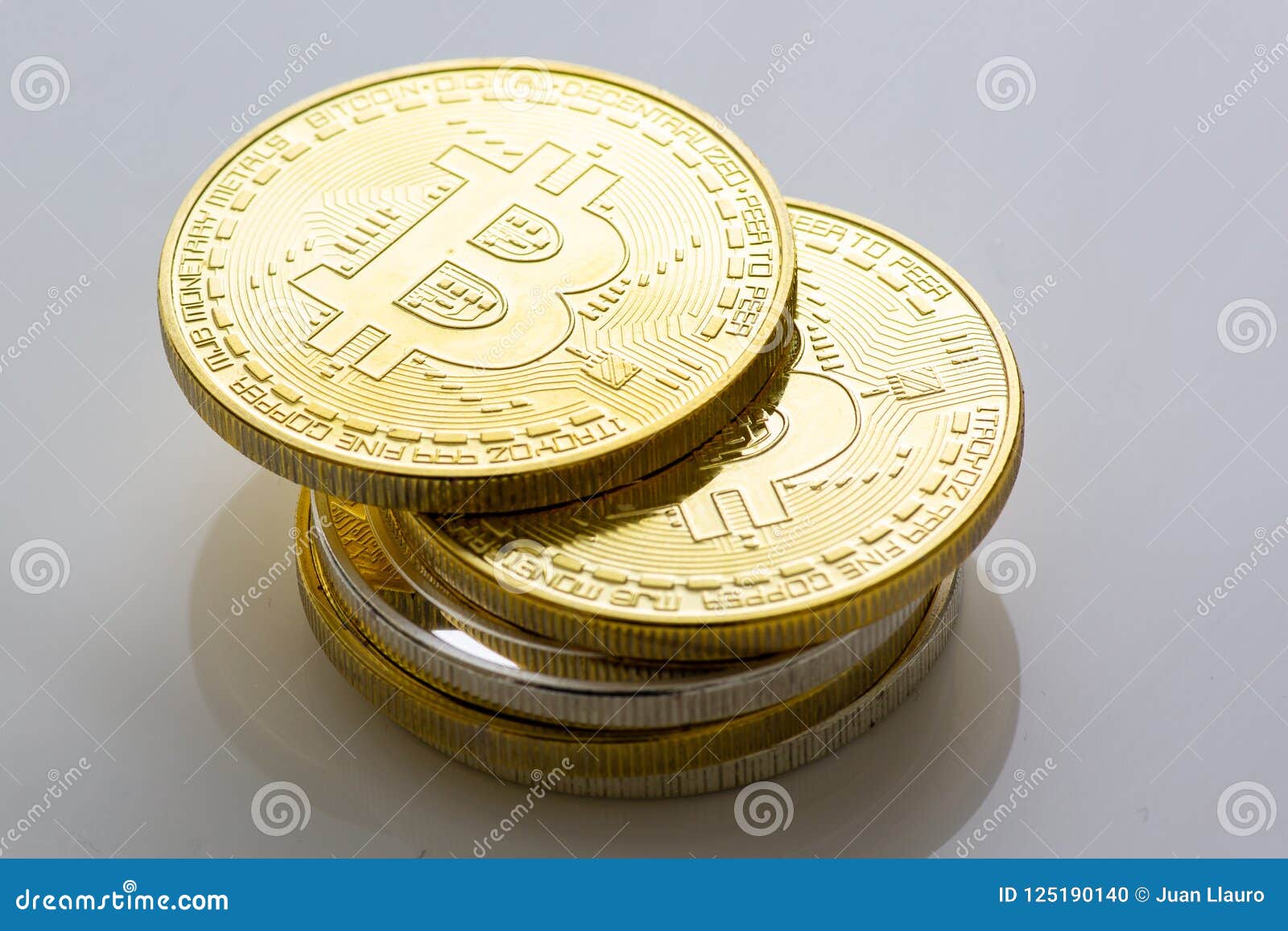 Stack of Bitcoins and Other Crypto Currencies on a White Table Stock ...