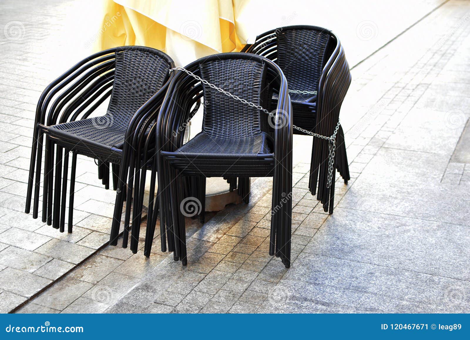 Stack of black chairs stock image. Image of street, cafe - 120467671