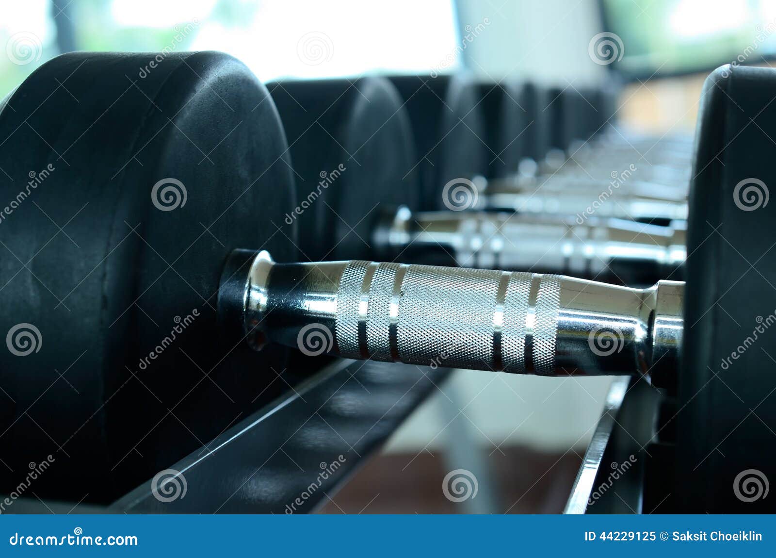 Stack of black dumbbells stock image. Image of exercise - 44229125