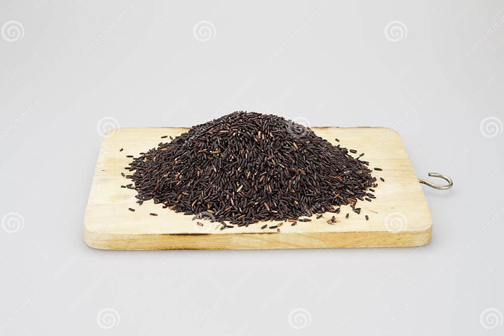 Stack of Black Rice Put on a Wooden Chopping Block Stock Photo - Image ...