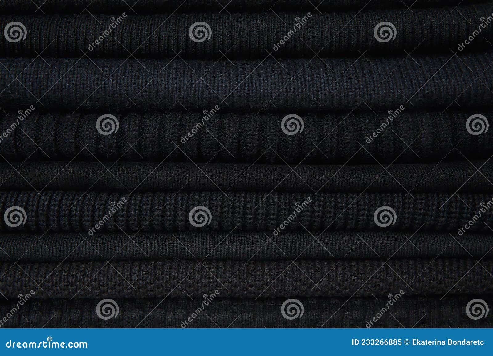 A Stack of Black Things, Clothes of Different Textures. Fabric Texture ...