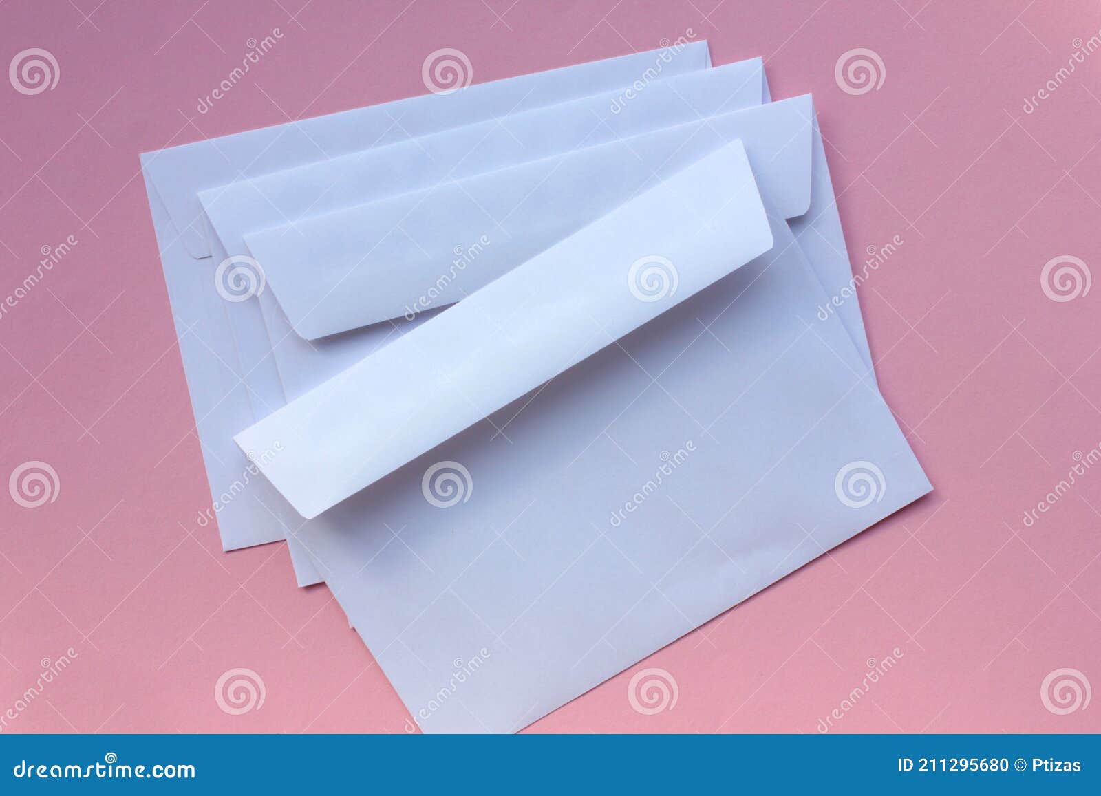 Stack of Blank Envelopes on a Pink Background. Mockup Invitation on ...