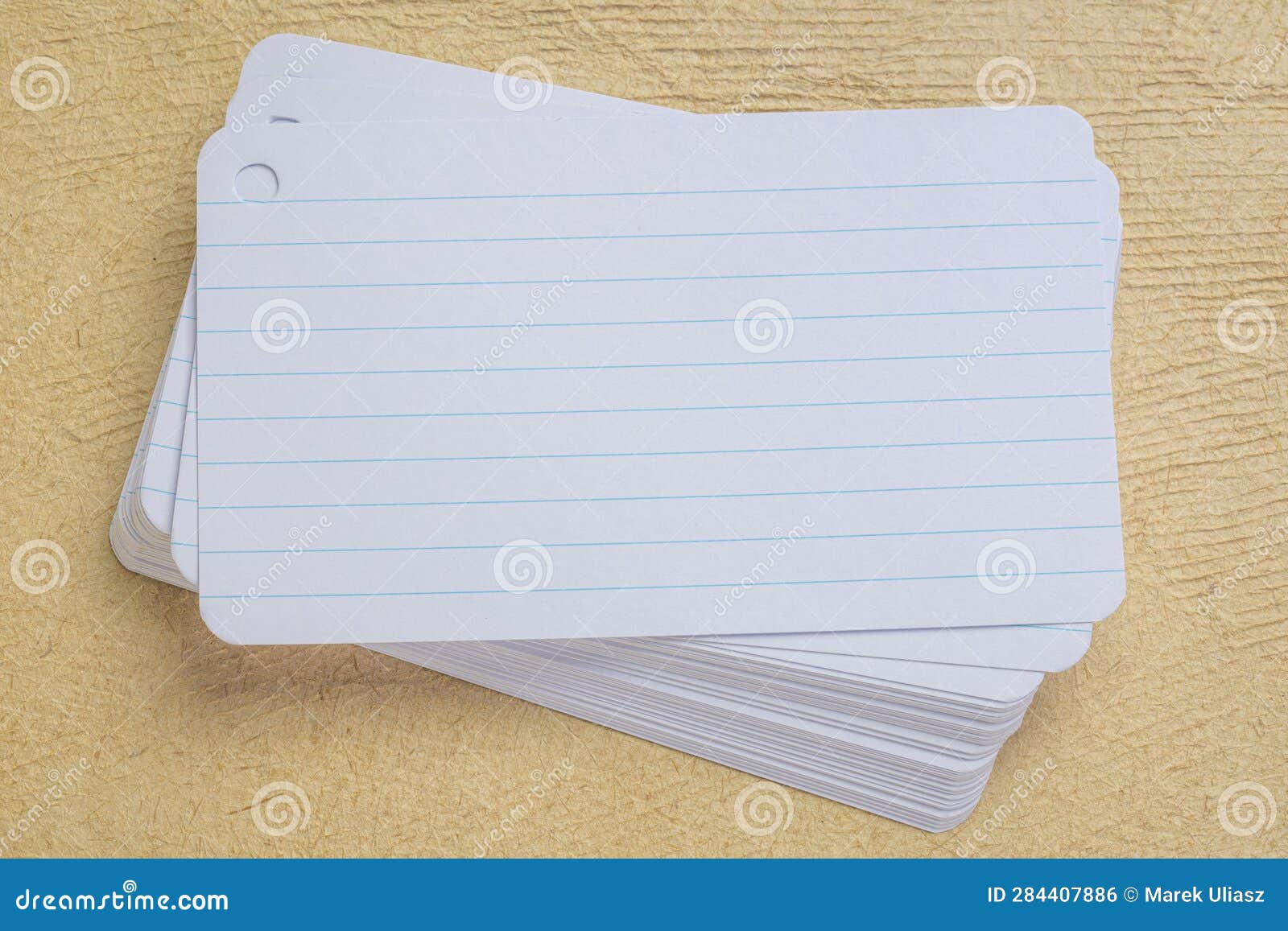 Stack of Blank Index Cards Against Textured Paper Stock Photo - Image ...