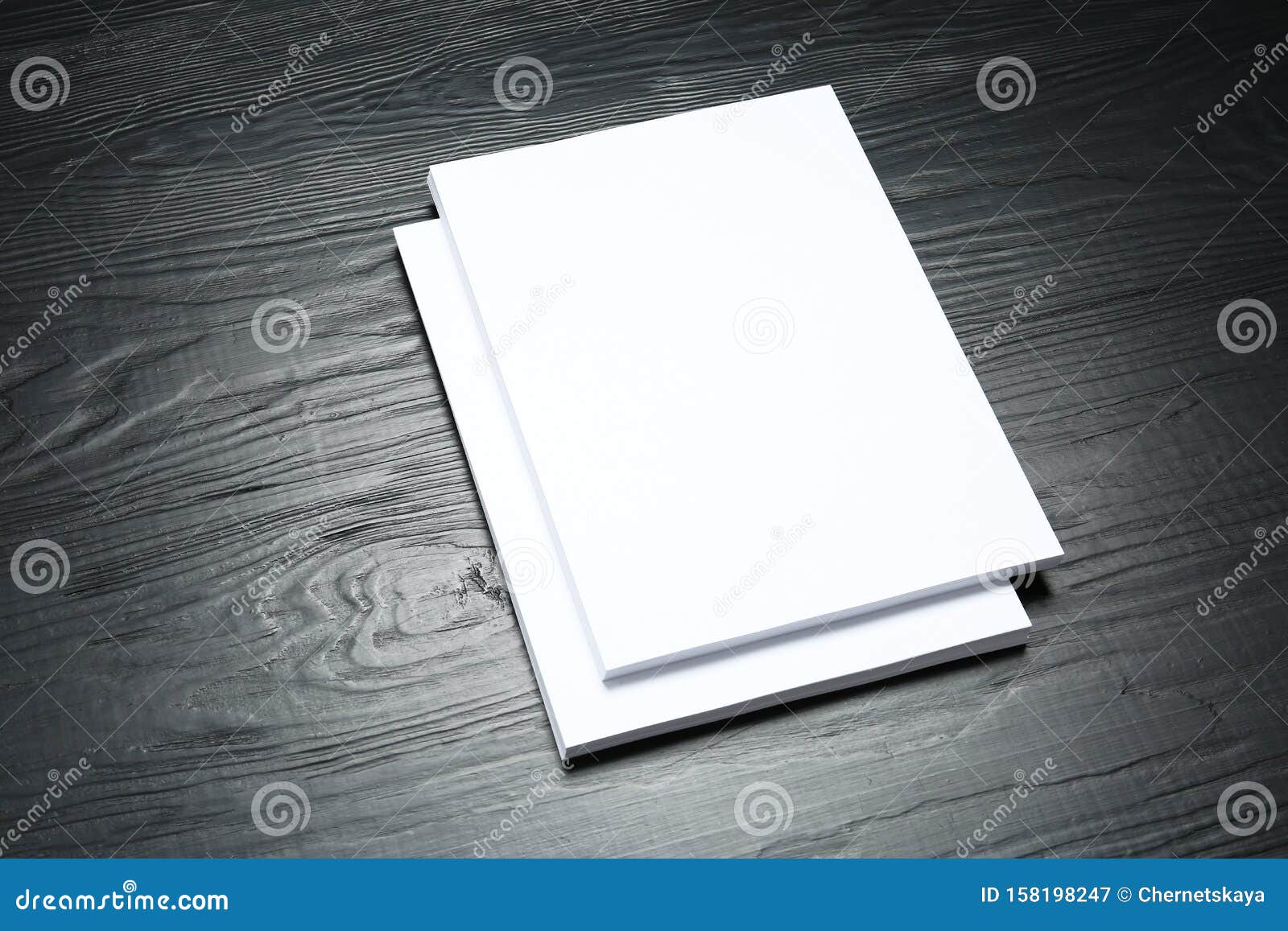 Stack of Blank Paper Sheets for Brochure on Black Wooden Background ...