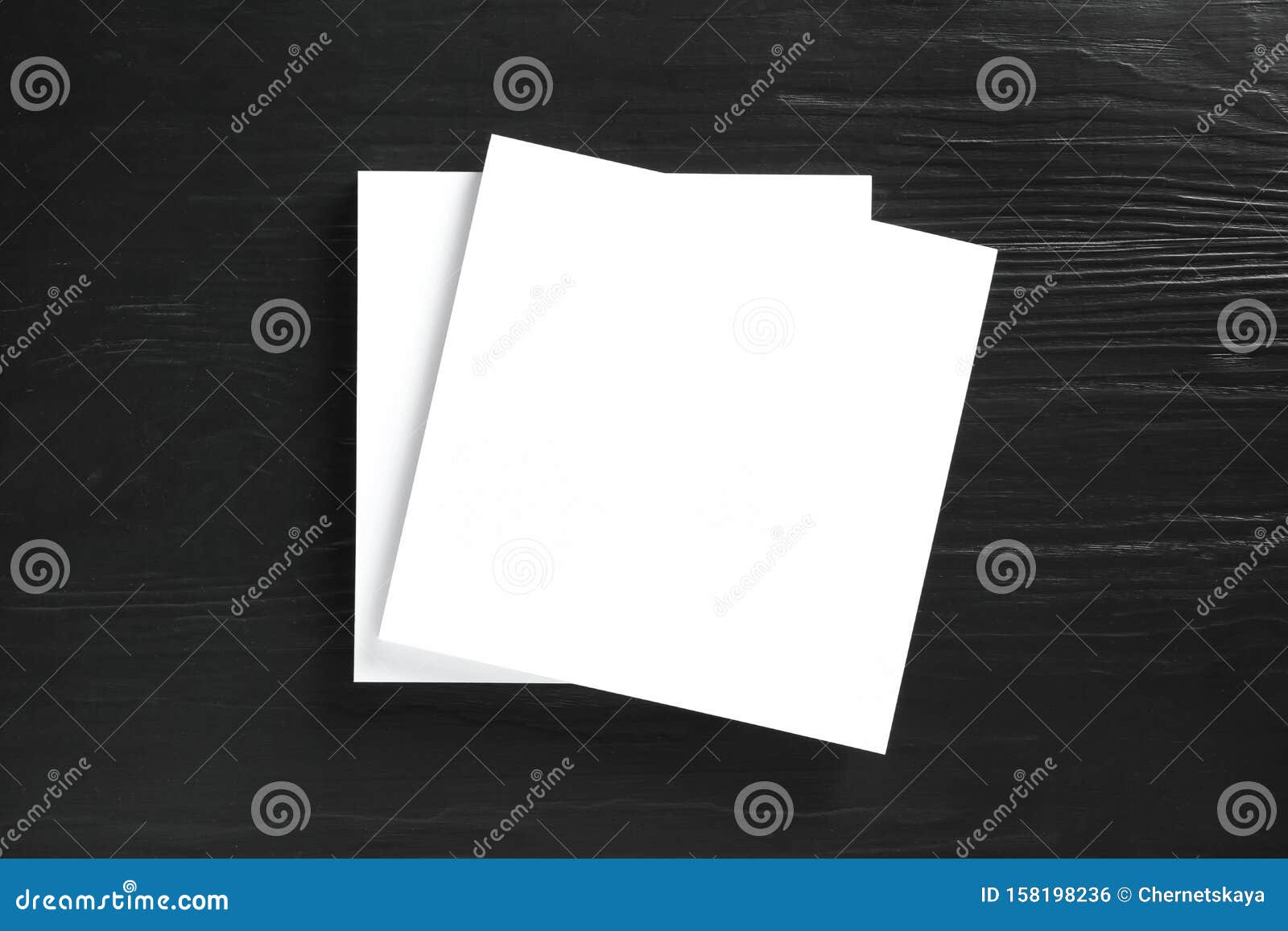 Stack of Blank Paper Sheets for Brochure on Black Wooden Background ...