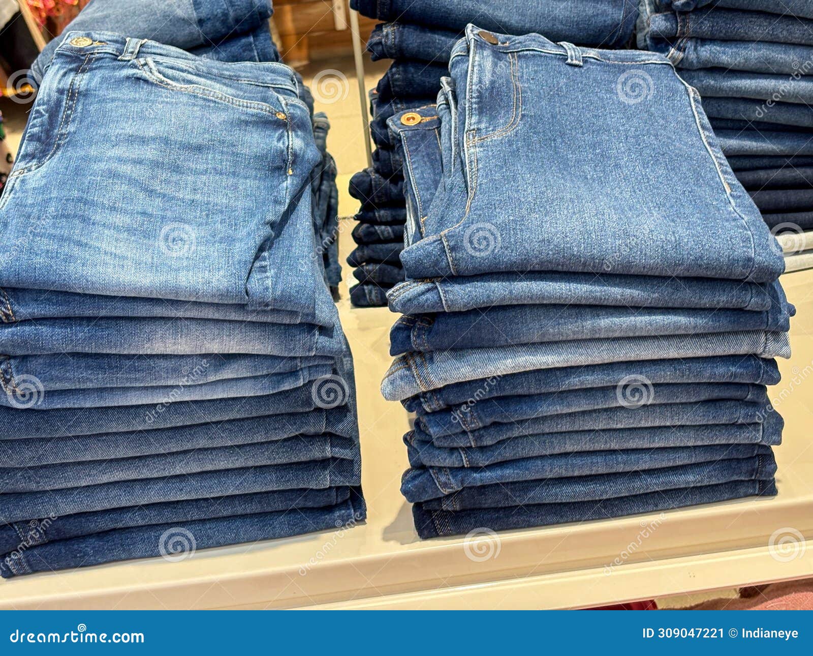Stack of Blue Denim Jeans in a Shopping Mall Stock Image - Image of ...
