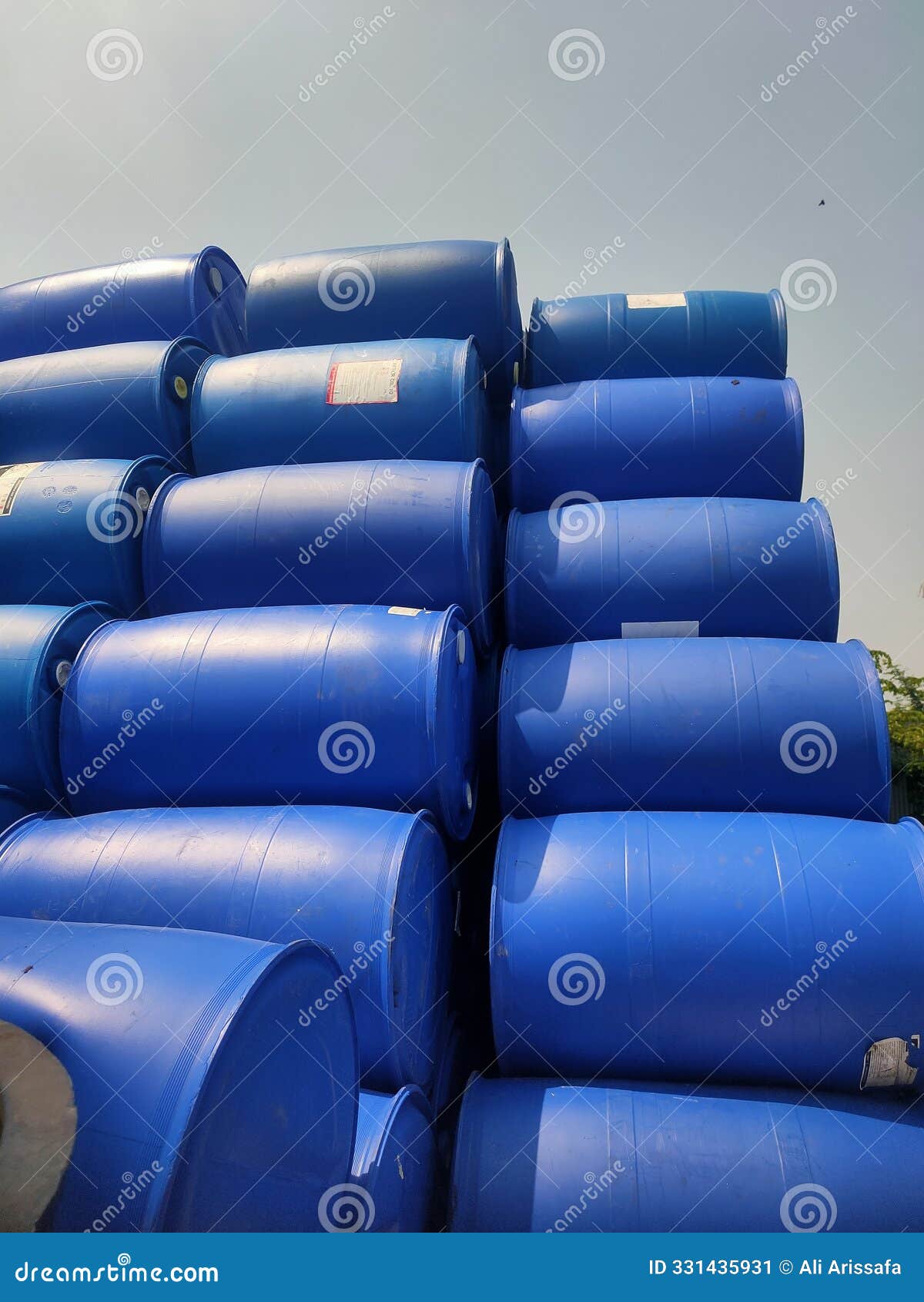 A Stack of Blue Drums with a Bright Sky Background is Very Neat and ...