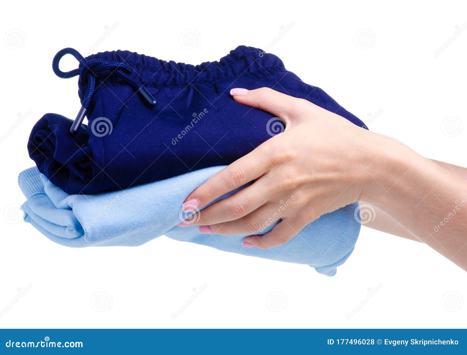 Stack Blue Folded Clothing in Hand Stock Photo - Image of fabric ...