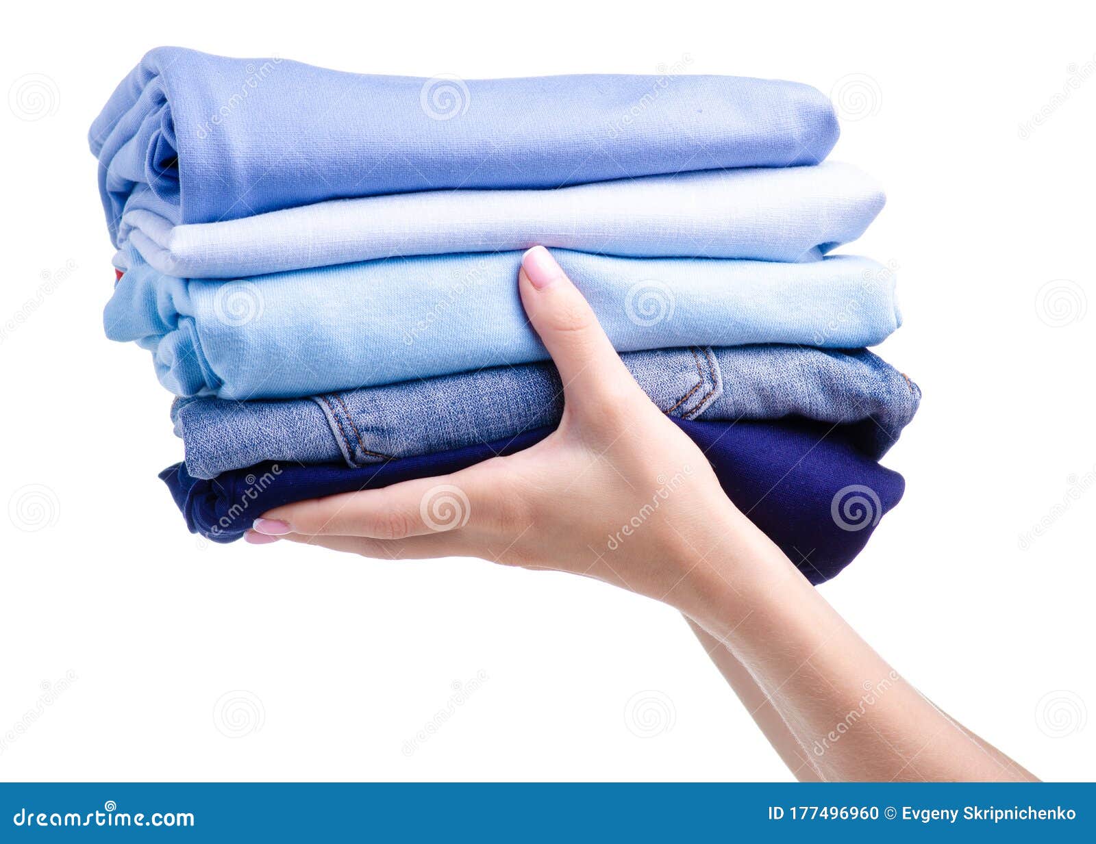 Stack Blue Folded Clothing in Hand Stock Photo - Image of color, casual ...