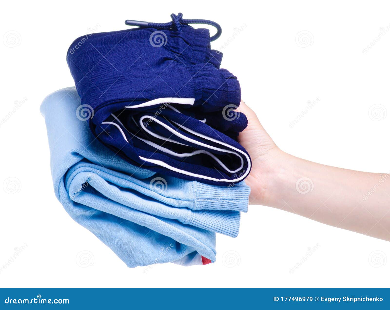 Stack Blue Folded Clothing in Hand Stock Image - Image of heap ...