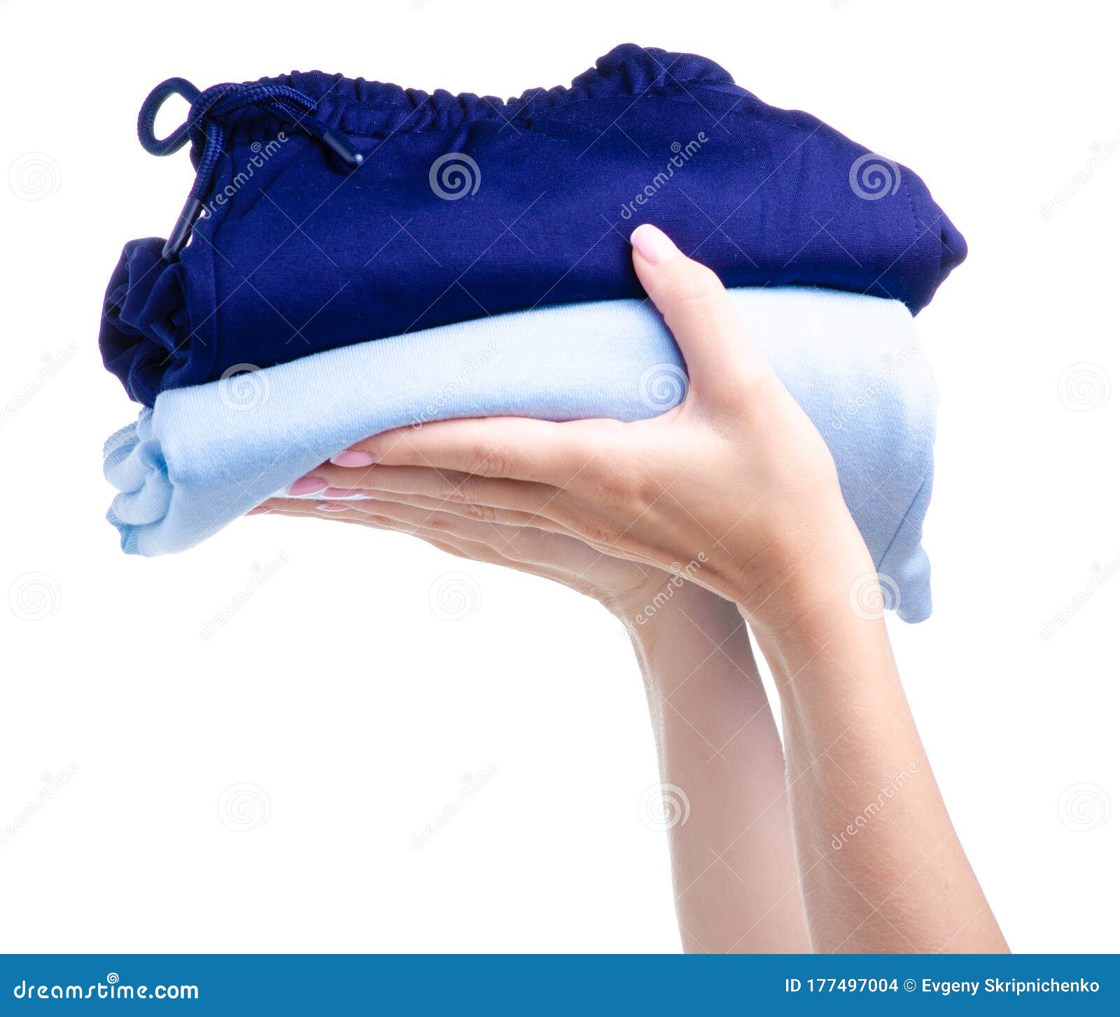 Stack Blue Folded Clothing in Hand Stock Photo - Image of jeans, cloth ...