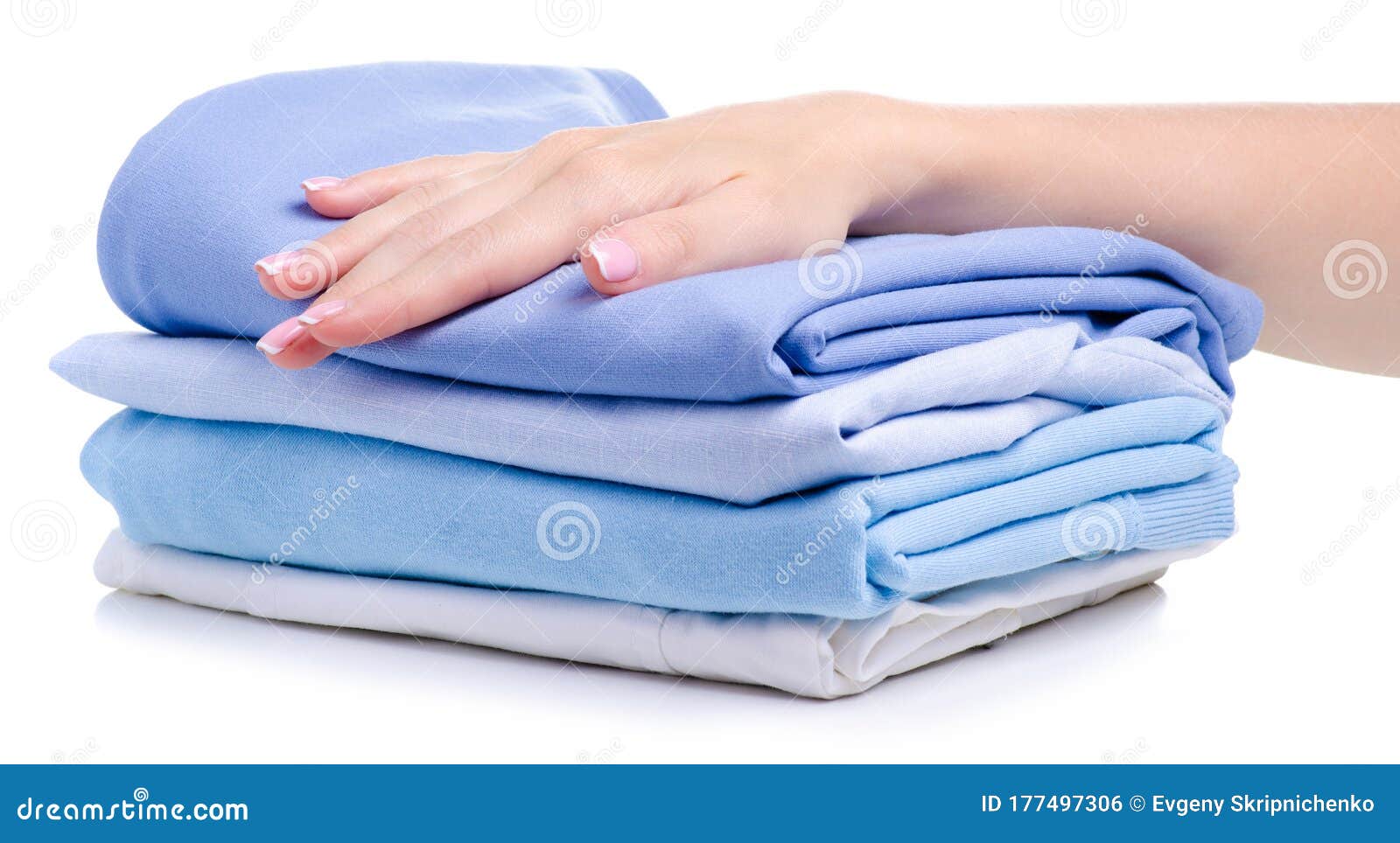Stack Blue Folded Clothing in Hand Stock Photo - Image of business ...