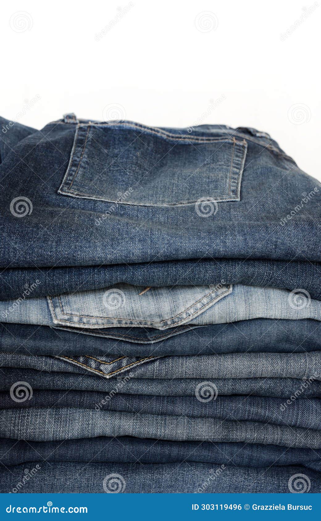 Stack of blue jeans. stock photo. Image of isolated - 303119496