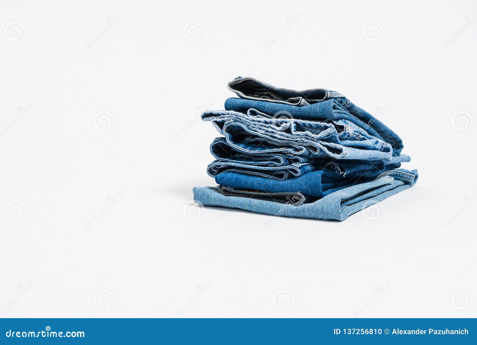 Stack of Blue Jeans on White Background. Stock Photo - Image of attire ...