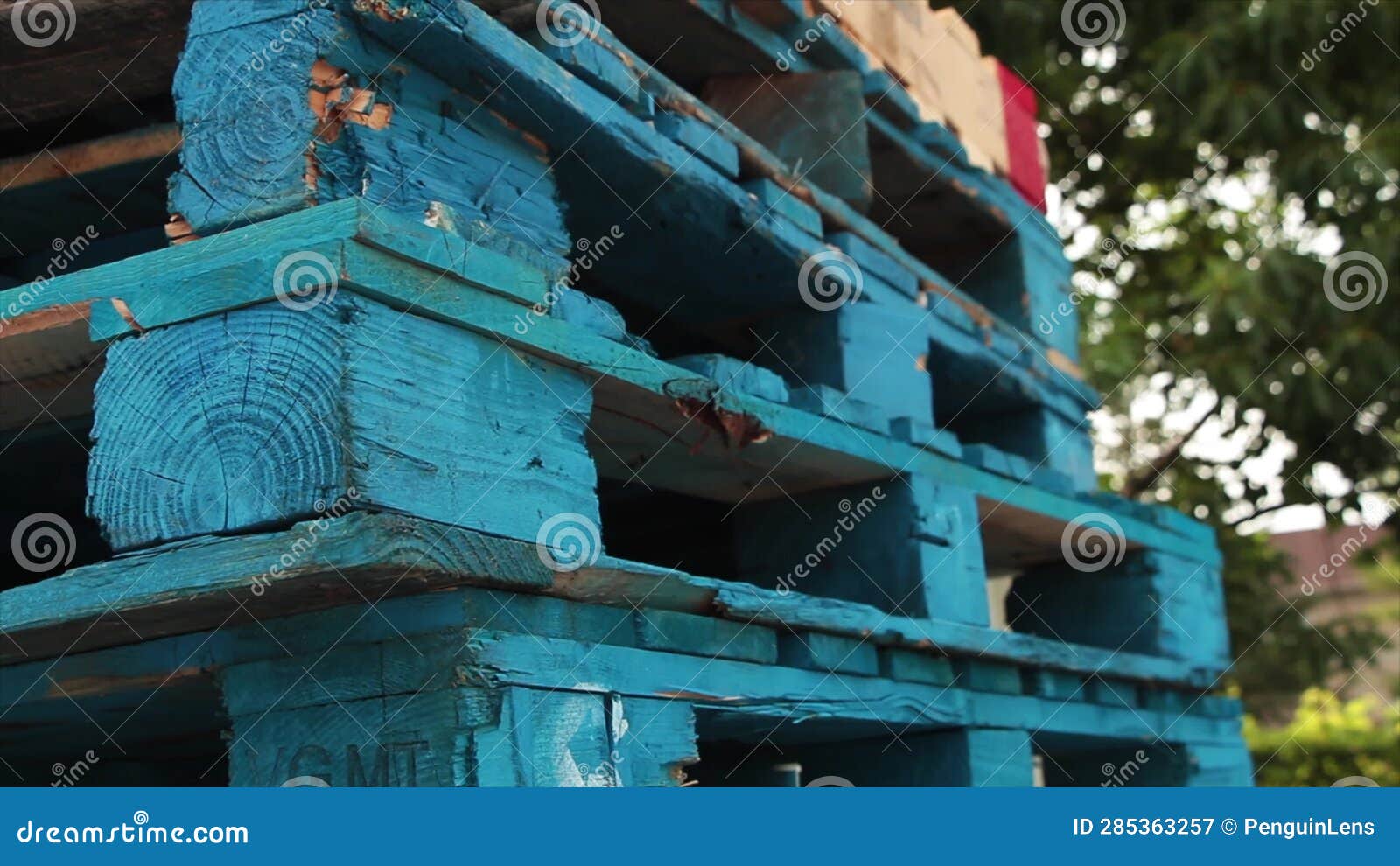 Stack of Blue Palettes Skids on Top of One Another with Wood Colored ...