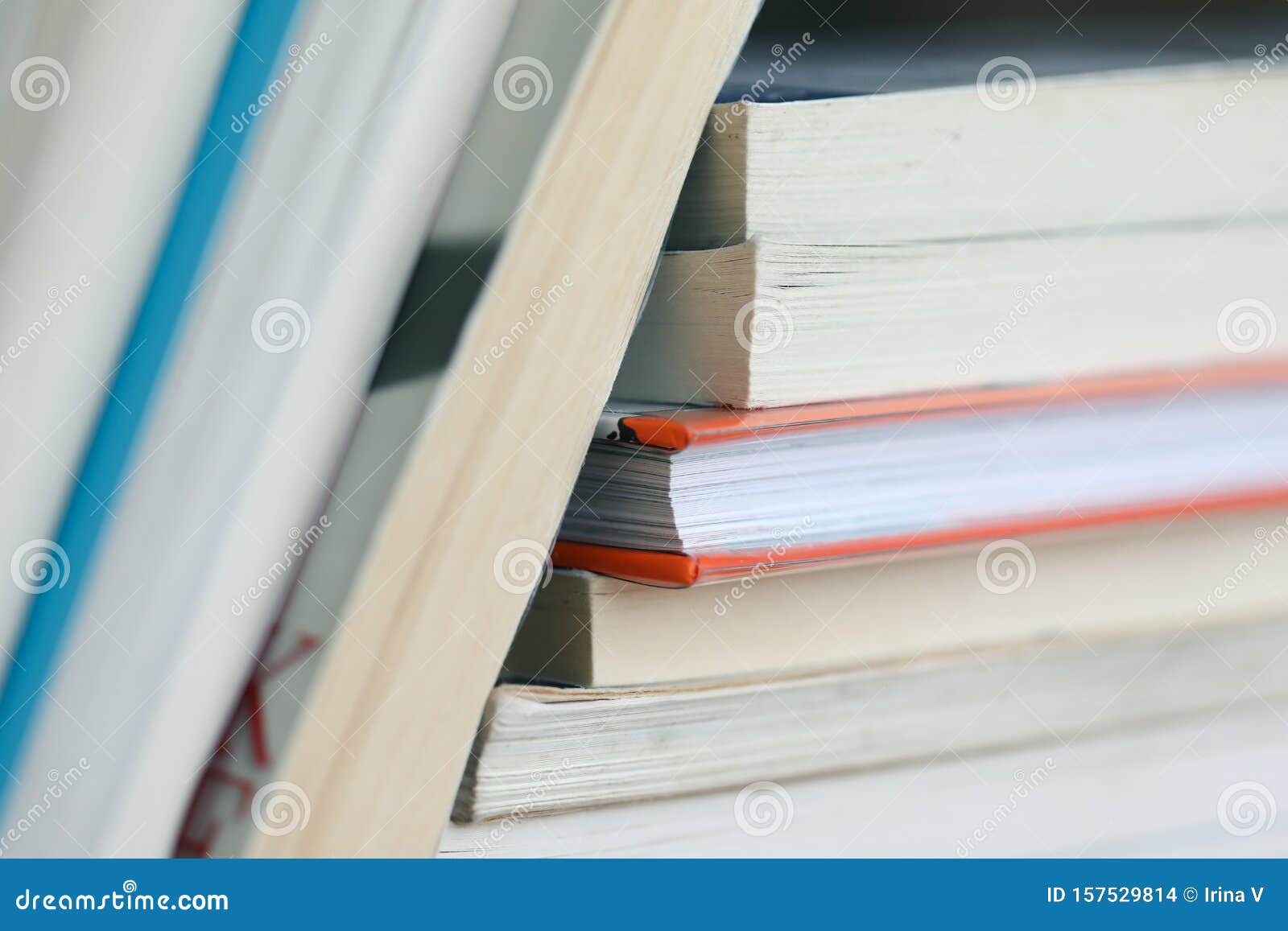 A Stack of Book Leaning on a Pile of Books, Artistically Arranged ...