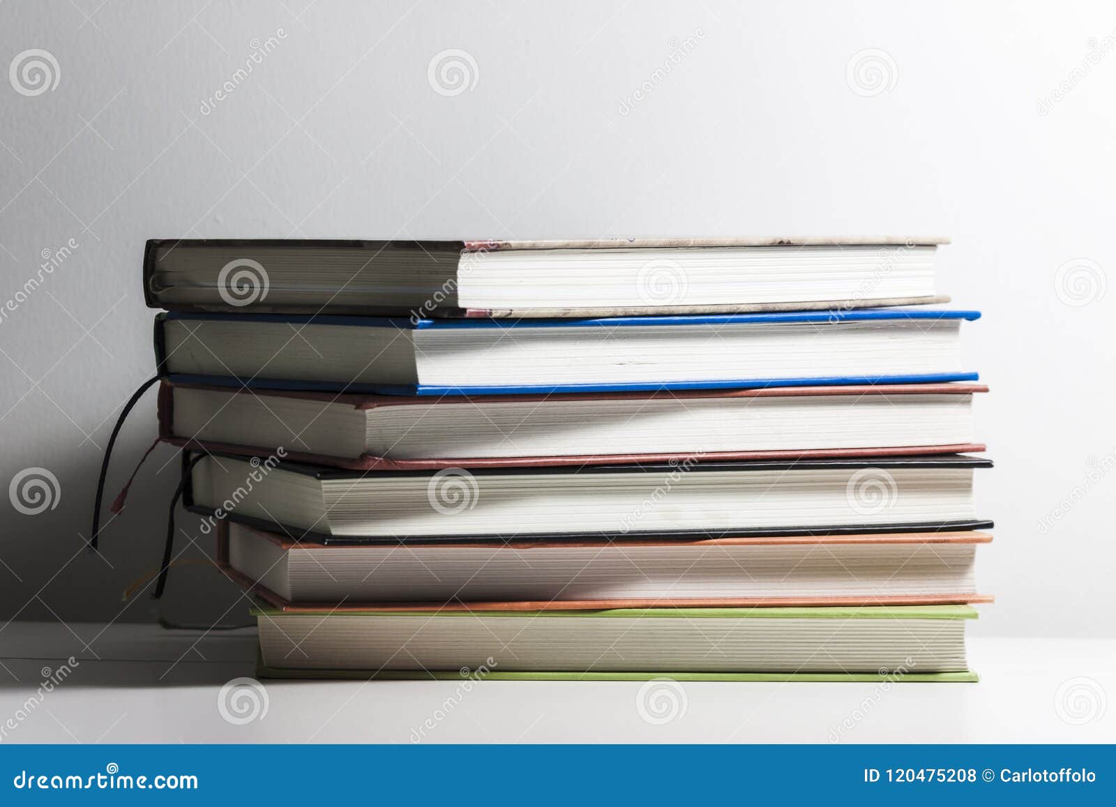 Stack of Book on a White Desk Stock Photo - Image of paper, writing ...