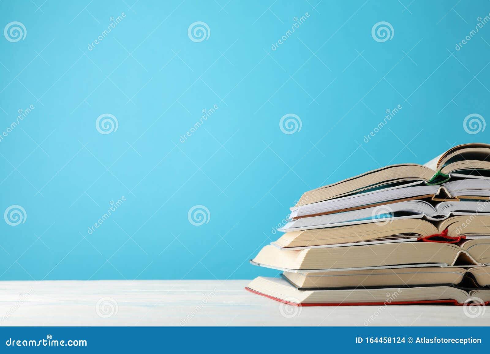Stack of Books Against Blue Background Stock Photo - Image of tale ...