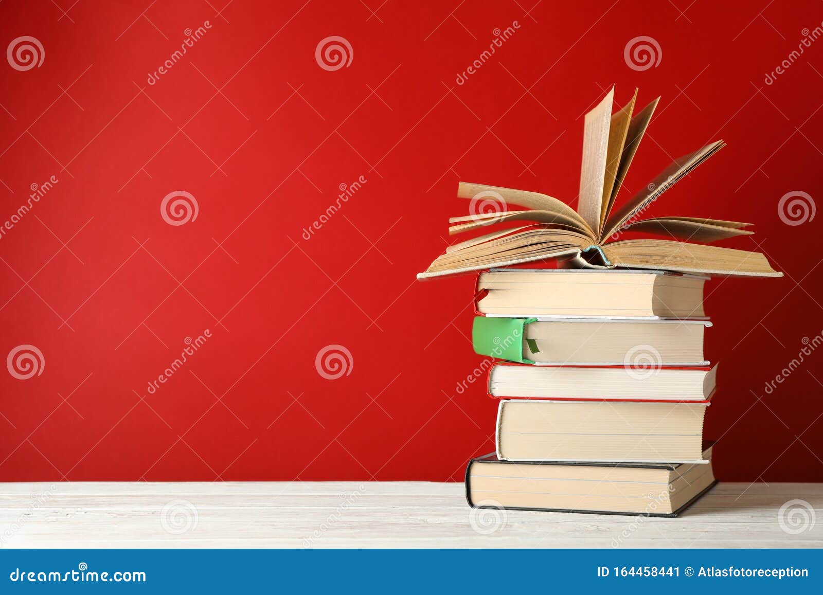 Stack of Books Against Red Background Stock Image - Image of book ...