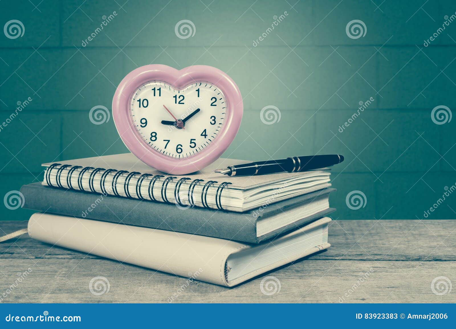Stack of Books and an Alarm Clock Stock Image - Image of book, back ...
