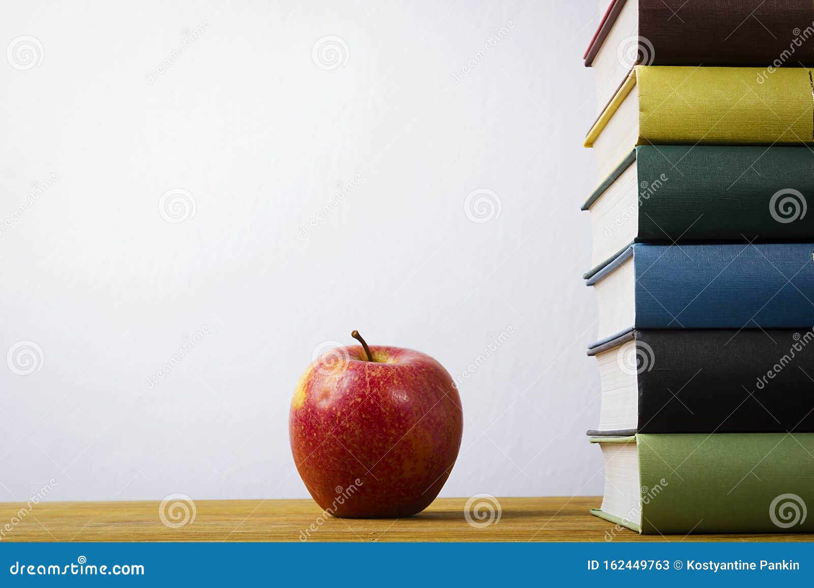 Stack of books and apple stock image. Image of apple - 162449763