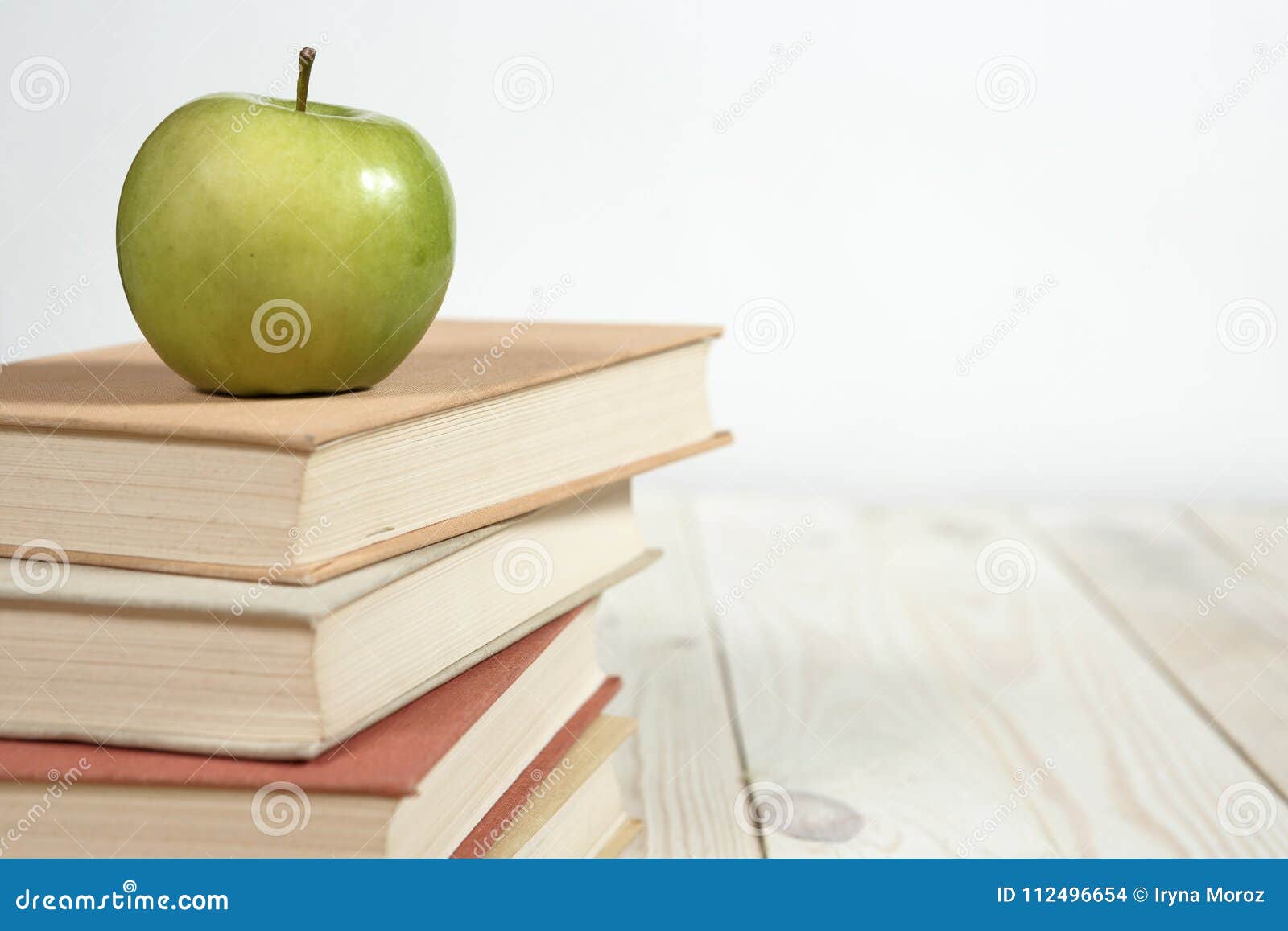 Stack of Books and Apple on the Table Stock Photo - Image of grunge ...