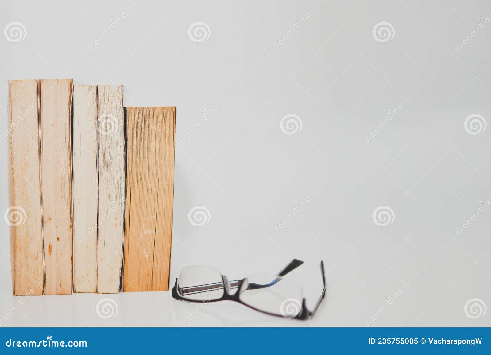 Stack of Books Arranged Horizontally on White Background with Glasses ...
