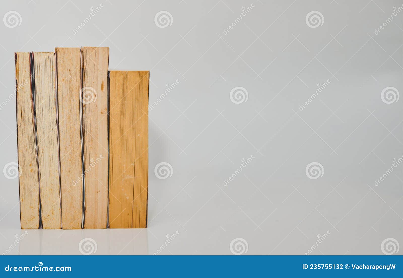 Stack of Books Arranged Horizontally on White Background Stock Photo ...