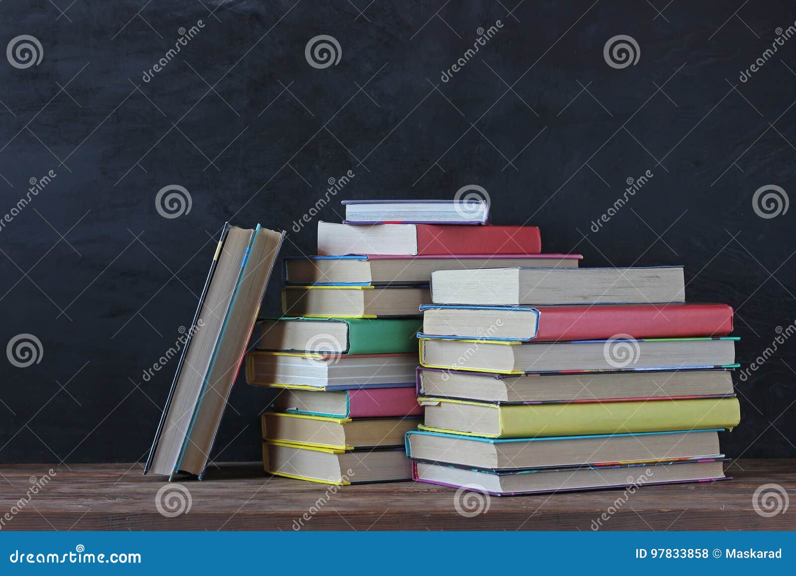 Stack of Books on the Background of the School Board. Stock Photo ...