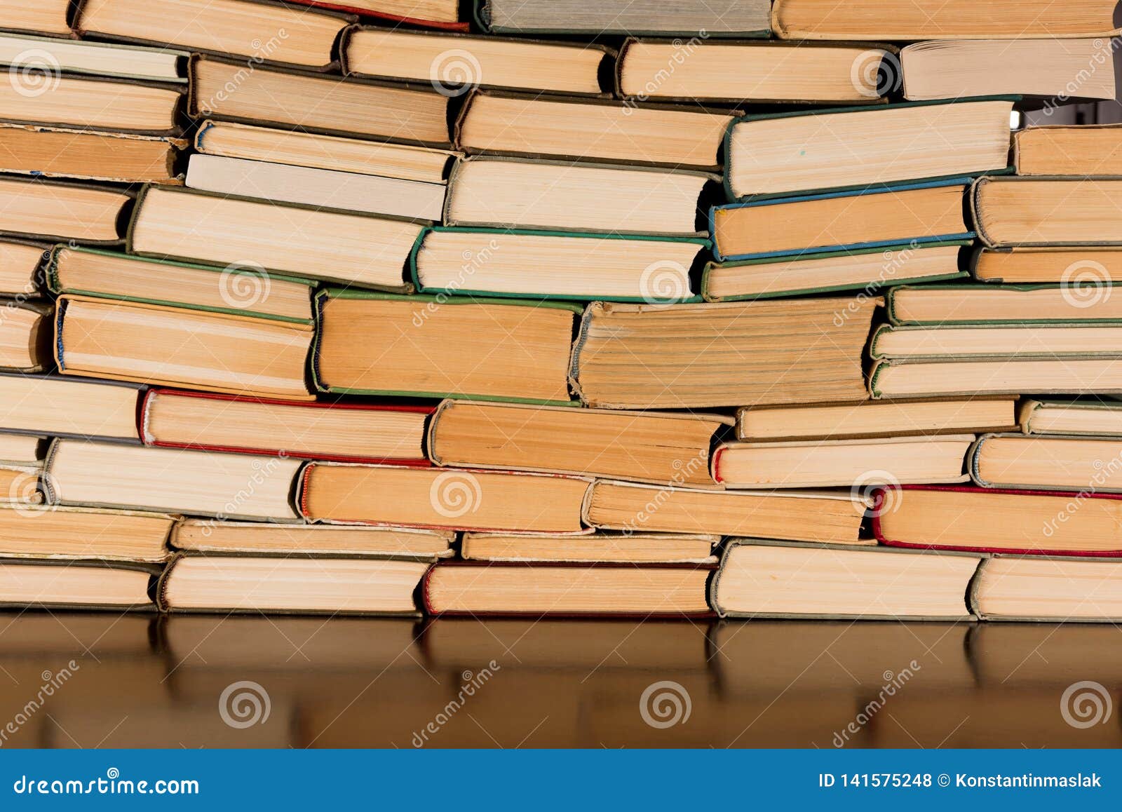 Stack of books background stock photo. Image of brown - 141575248