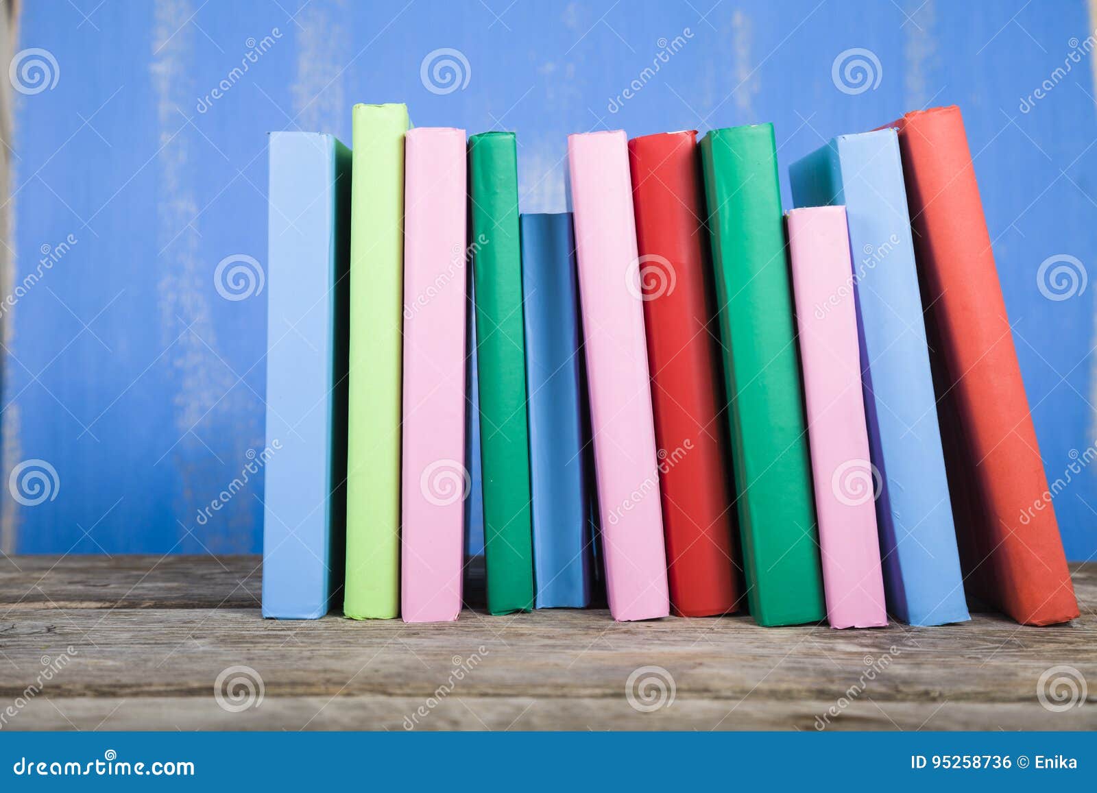 Stack of Books on a Blue Background. Stock Photo - Image of book, multi ...