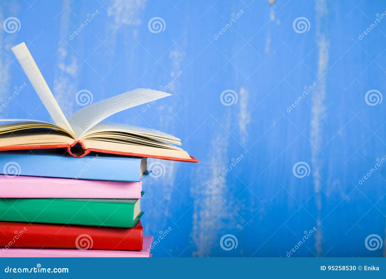 Stack of Books on a Blue Background. Stock Photo - Image of education ...